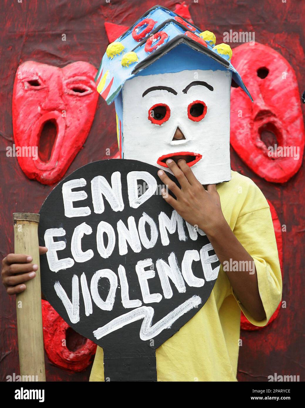 A Filipino activist wears a mask during a rally to commemorate ...