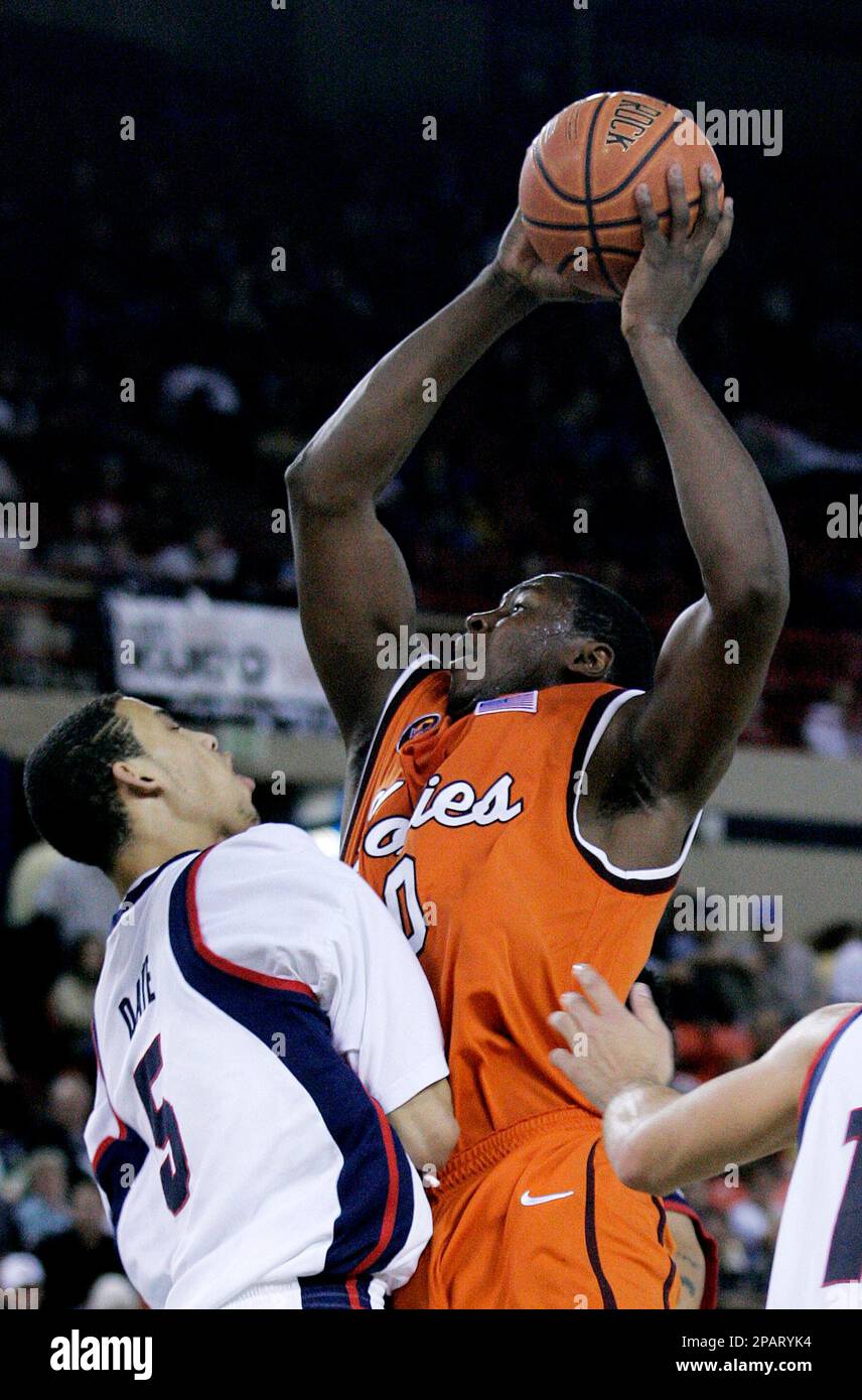 Virginia Tech's Jeff Allen , right, shoot for the basket over Gonzaga's ...