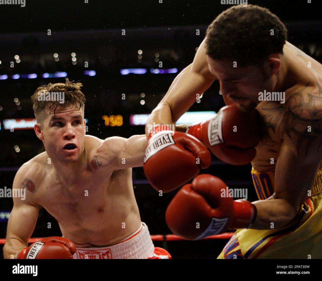 Jesse Feliciano, left, lands a punch against Kermit Cintron during an ...