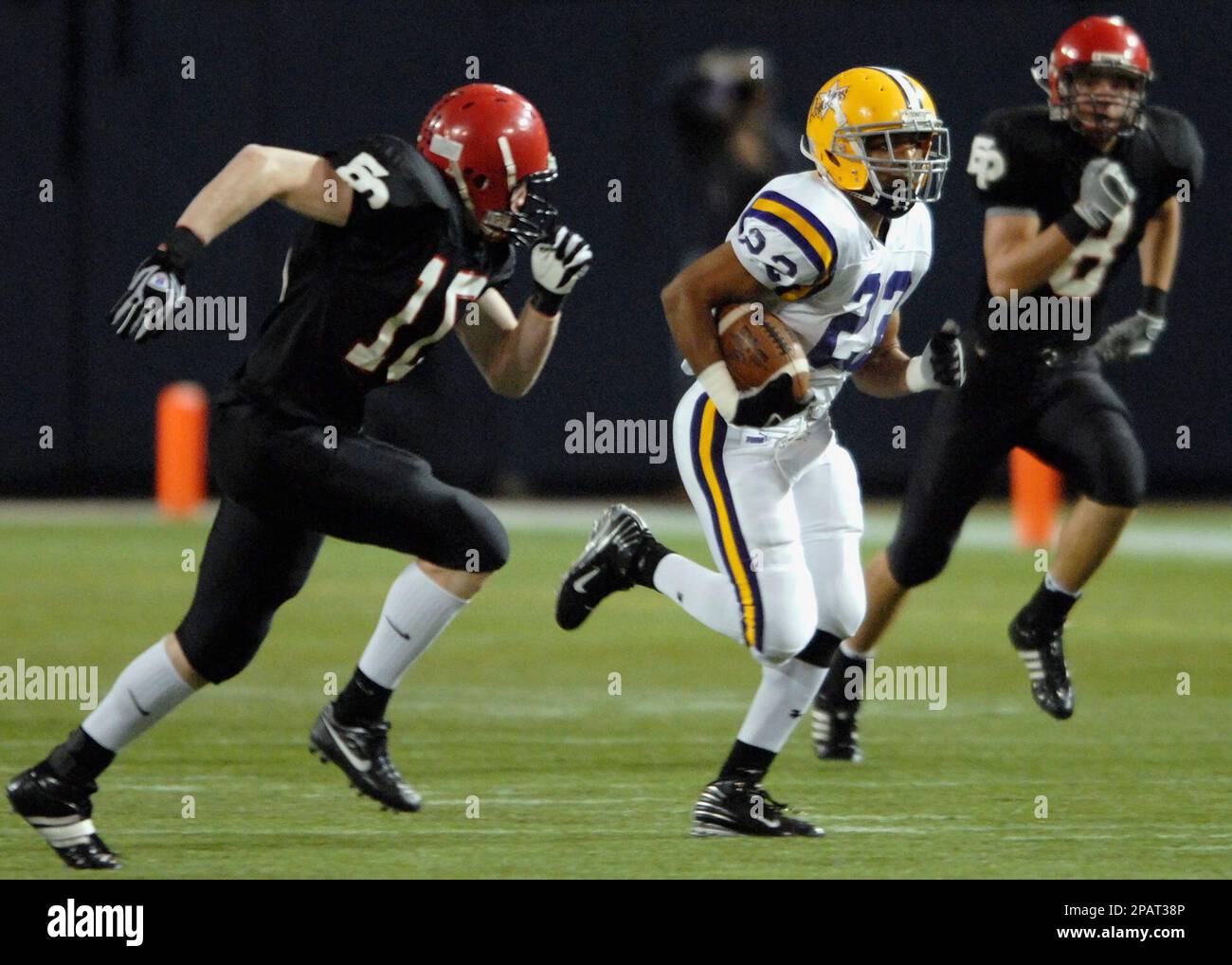Cretin-Derham Hall's Marcus Binns, center, runs past Eden Prairie ...