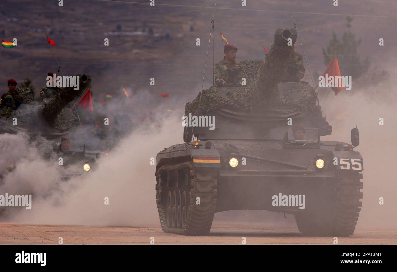Bolivian soldiers ride in tanks at a military parade commemorating the ...