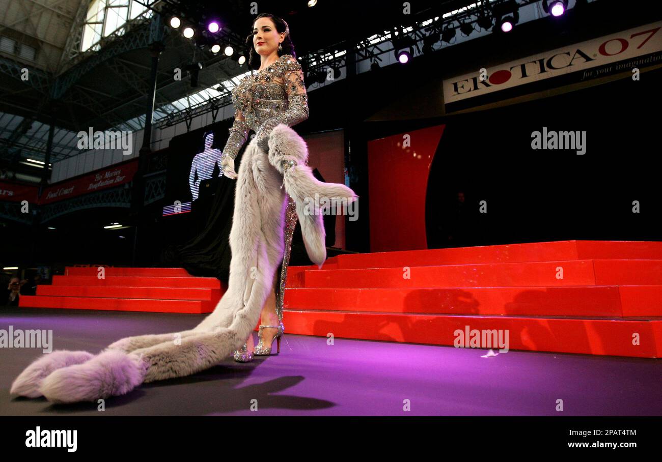 Dita Von Teese, the U.S. burlesque artist poses on stage for ...