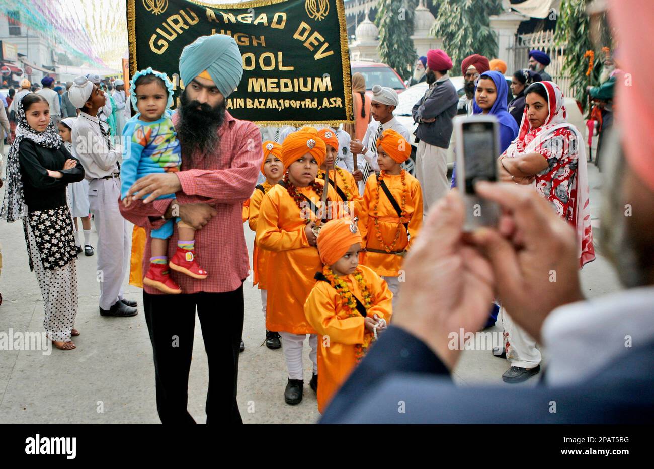 Boys dressed as baptized Sikhs participate in a religious procession to ...