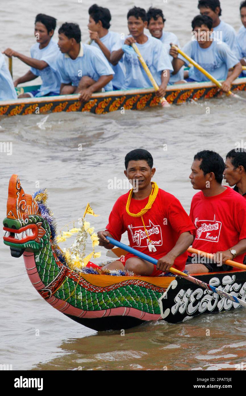 Cambodian boat racers row their wooden boats in first day of the water ...