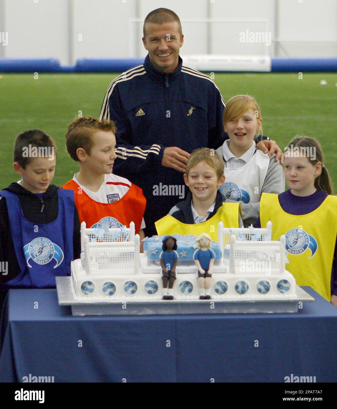 Soccer player David Beckham poses with a group of children at the David ...
