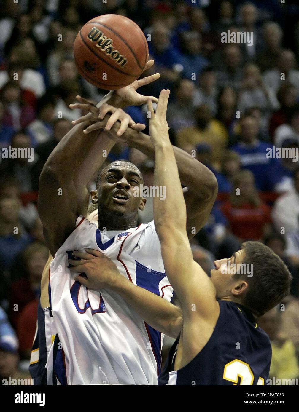 Kansas forward Darrell Arthur, left, gets past Northern Arizona guard ...
