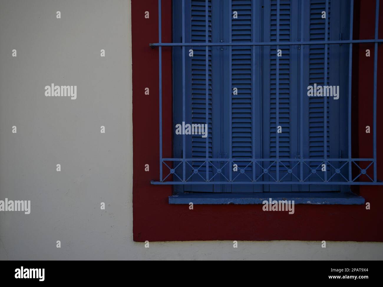 Old railway station window with handcrafted wrought iron grilles on an ...