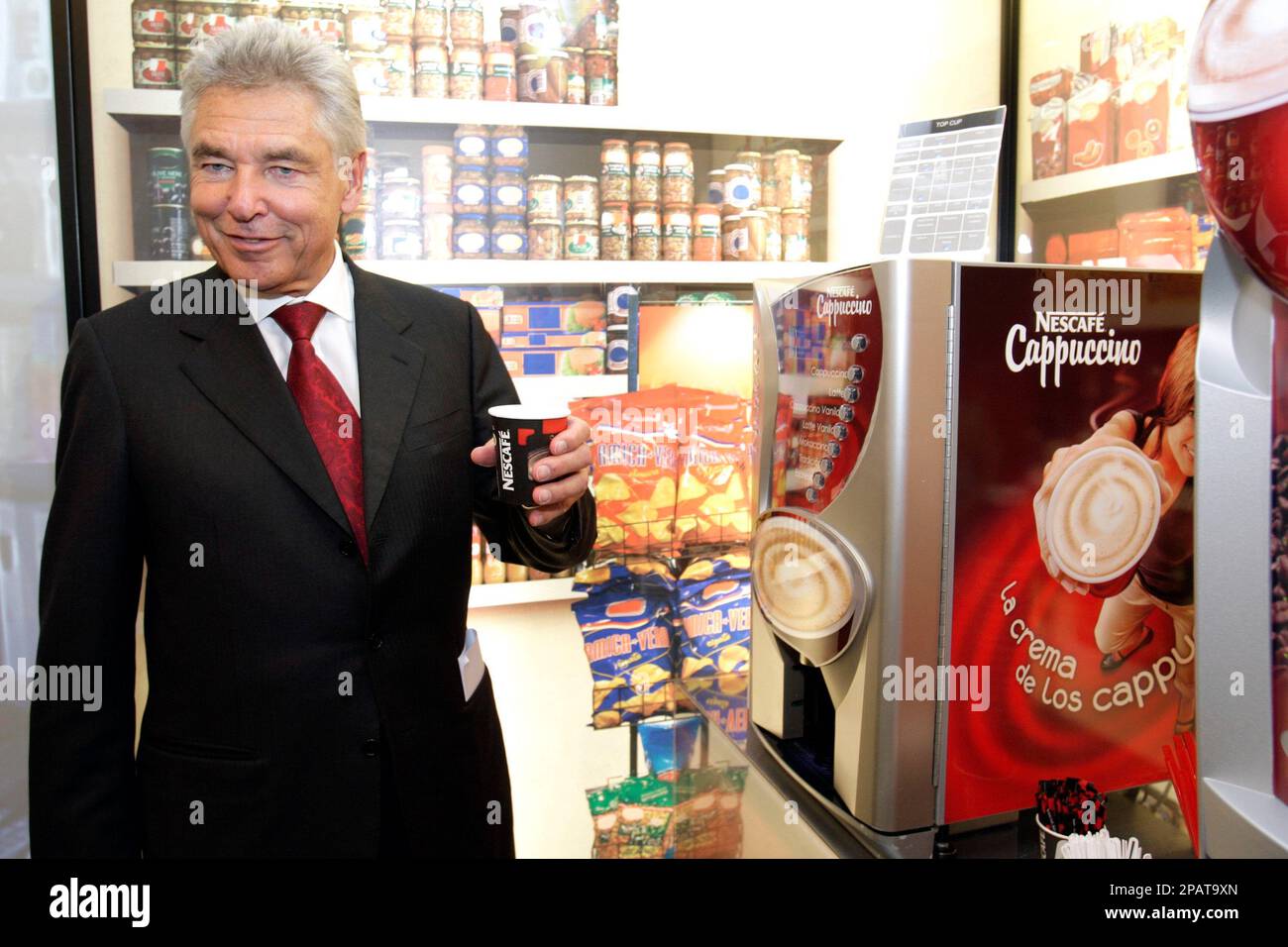 Nestle's Chairman and CEO Peter Brabeck-Letmathe, drinks a cup of ...