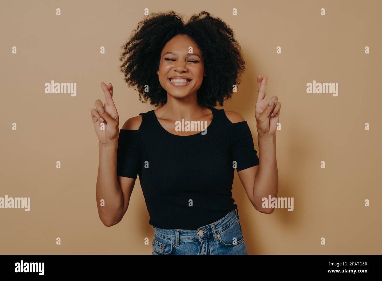 Cute lovely african american woman posing in casual clothes while ...
