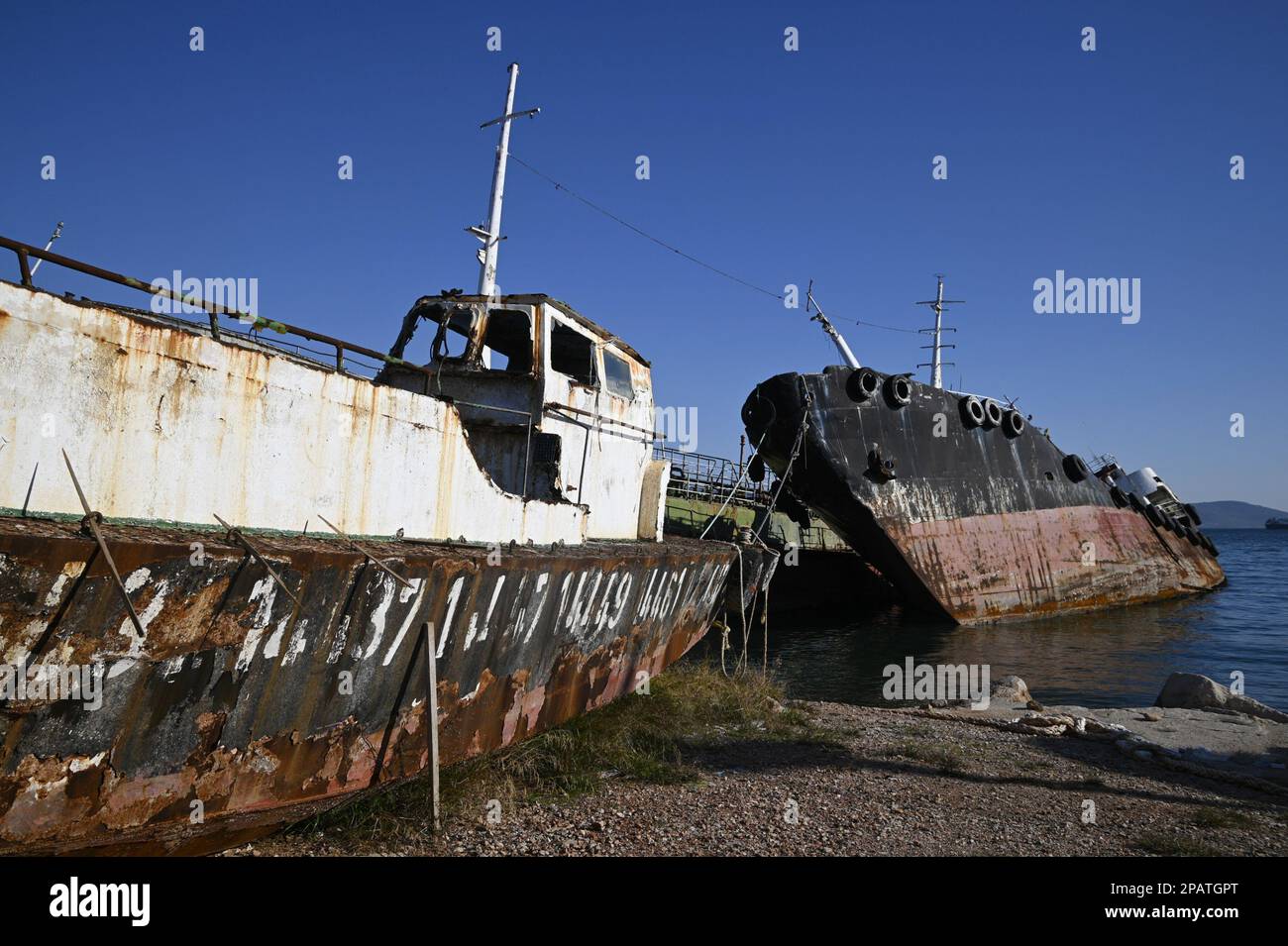 Landscape with various shipwrecks at the shallow Bay of Eleusis in ...