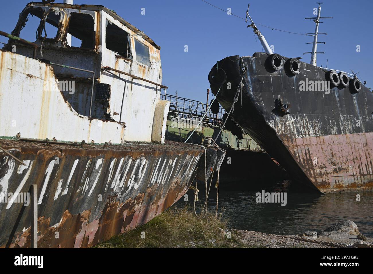 Landscape with various shipwrecks at the shallow Bay of Eleusis in ...