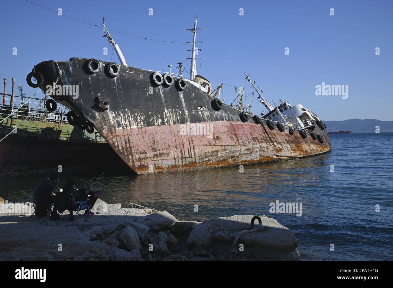 Landscape with various shipwrecks at the shallow Bay of Eleusis in ...