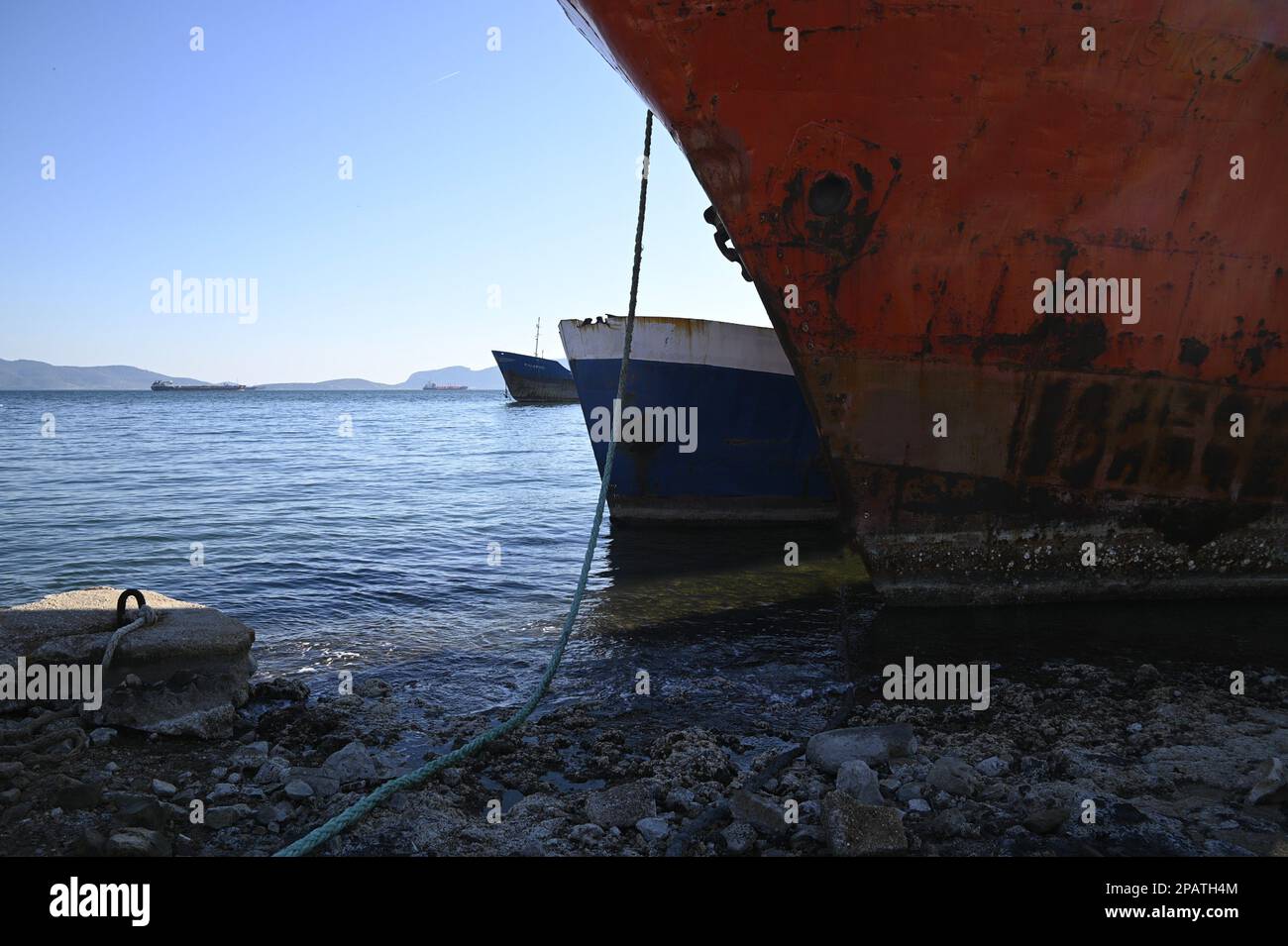Landscape with various shipwrecks at the shallow Bay of Eleusis in ...