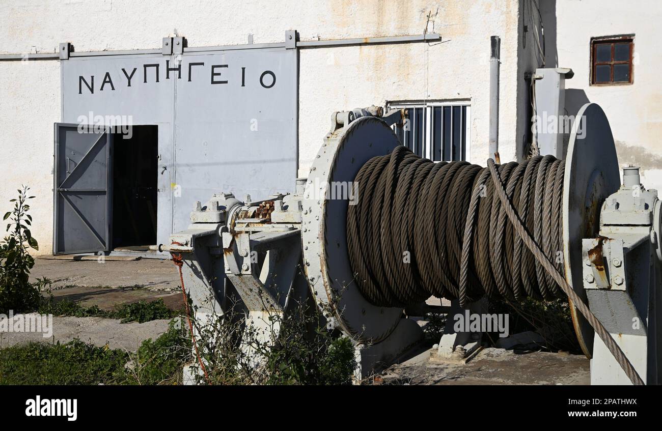 Scenic exterior view of a shipbuilding works shack with a sign written ...