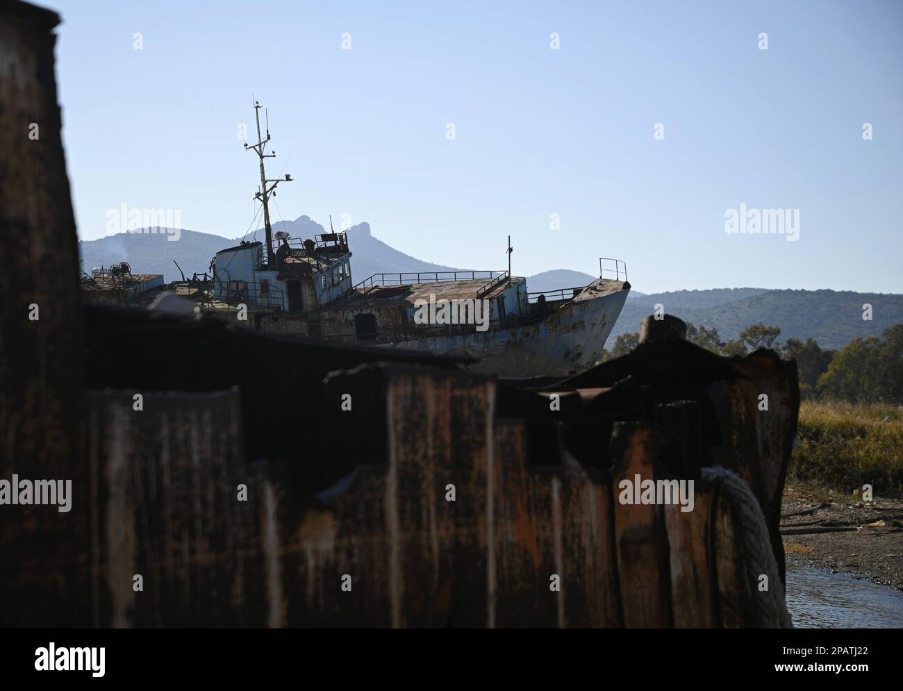 Landscape with various shipwrecks at the shallow Bay of Eleusis in ...