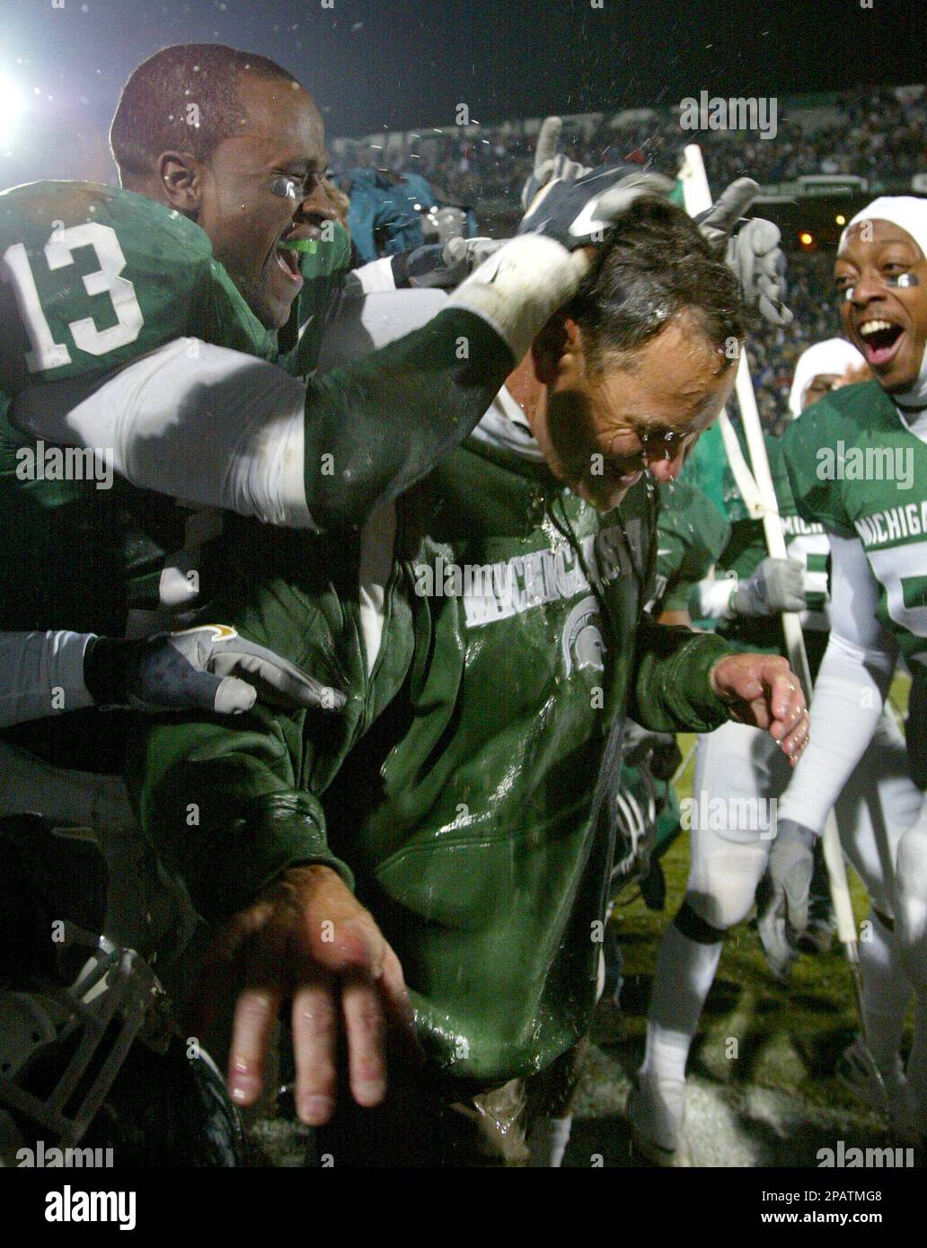 Michigan State's Travis Key (13) and Reggie Graham, right, celebrate ...