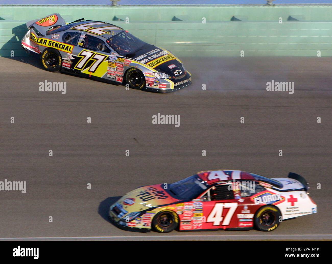 Bobby Labonte (77) hits crashes as Kelly Bires (47) drives past during ...