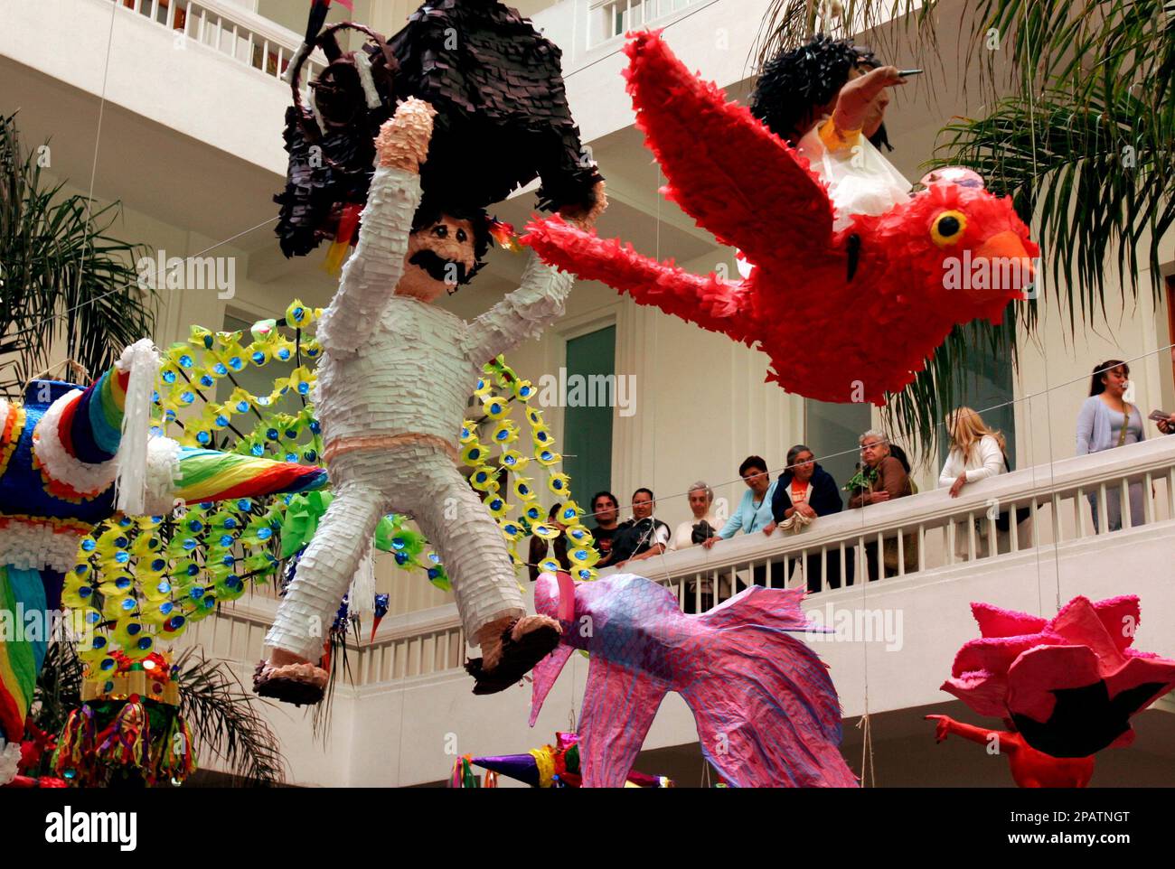 People look at pinantas competing in Mexico's first pinata competition in Mexico City, Saturday ...