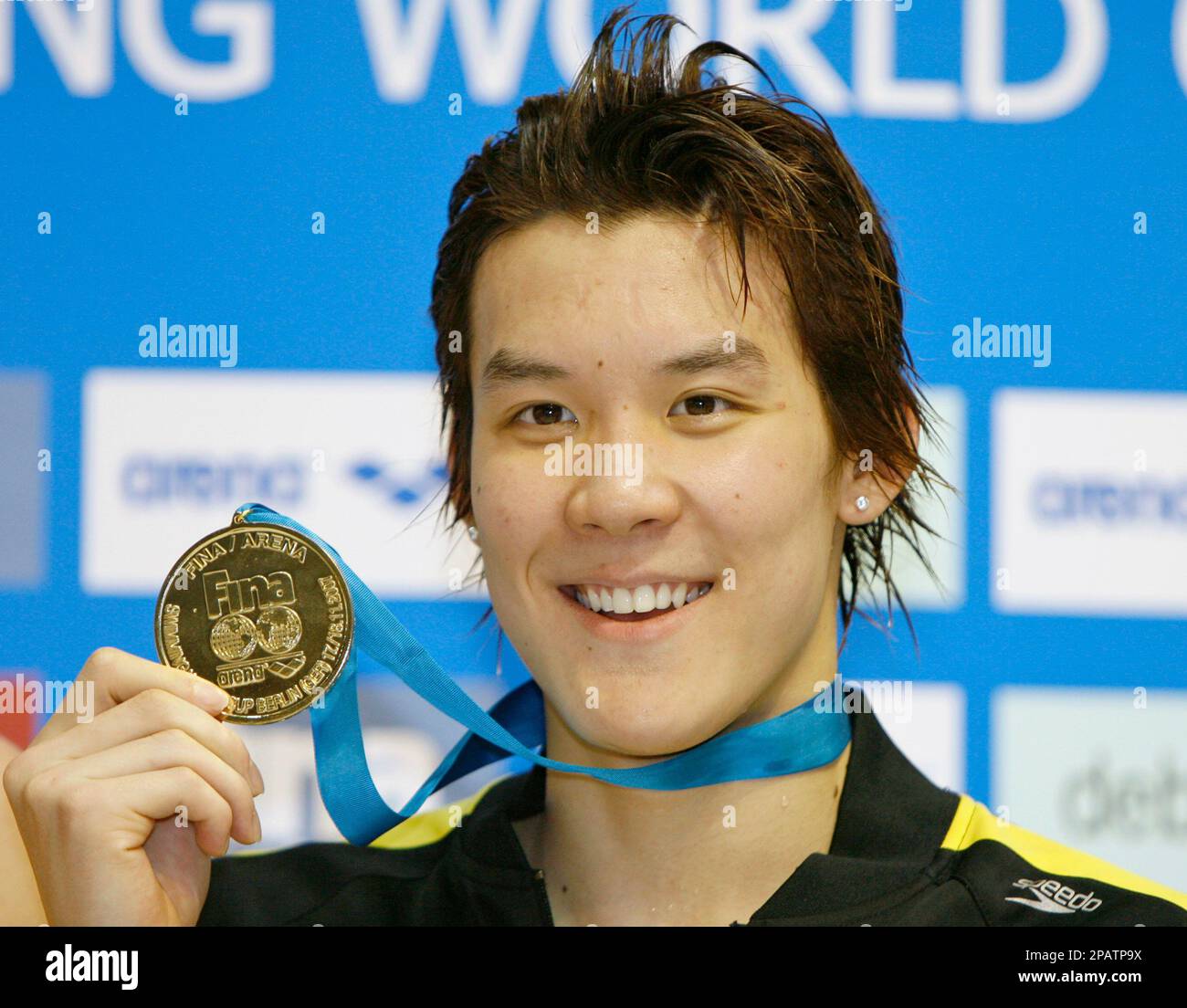 South Korea's swimmer Tae-Hawn Park poses with his gold medal during ...