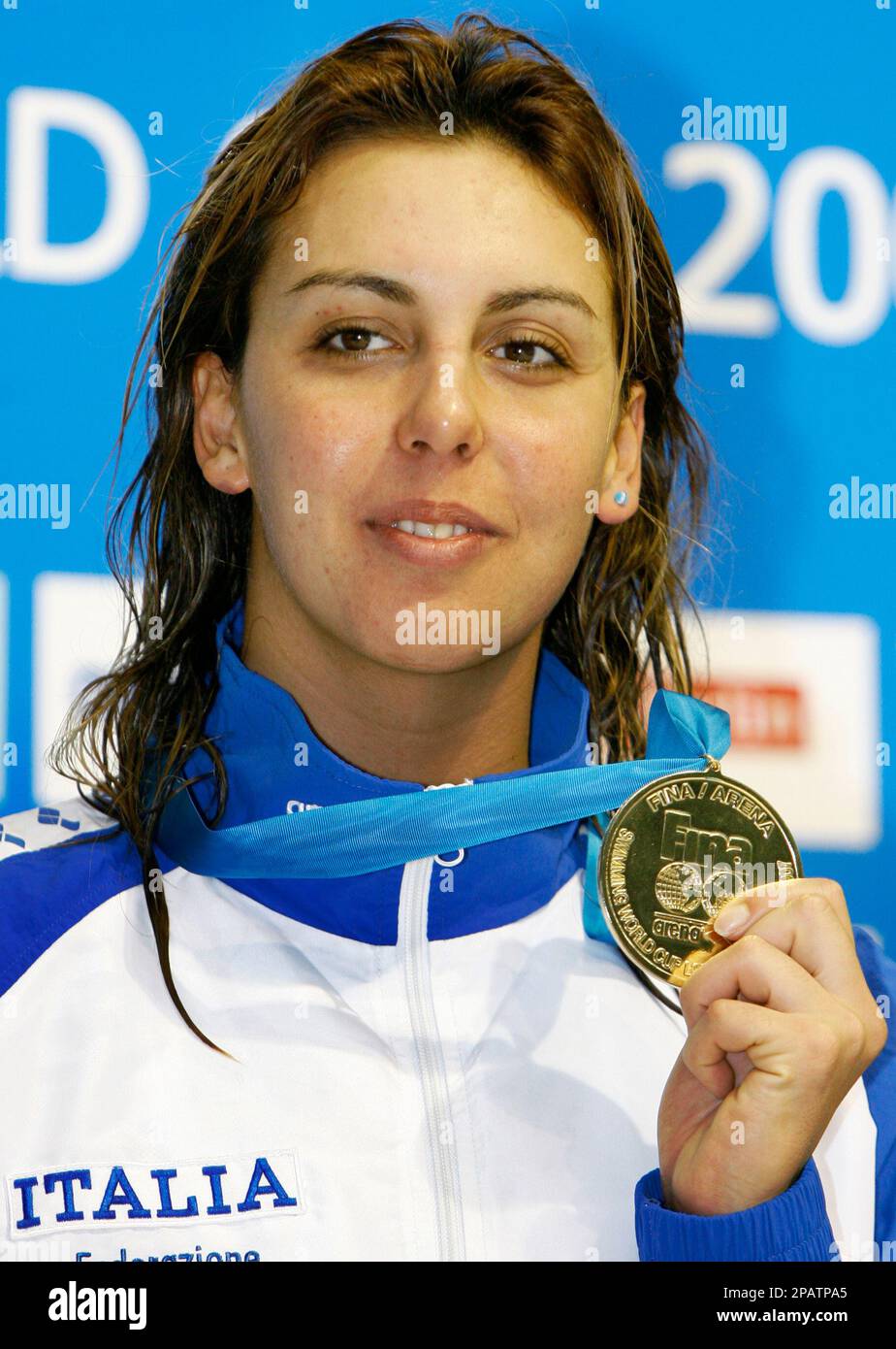 Italy's swimmer Alessia Filippi poses with her gold medal during the ...