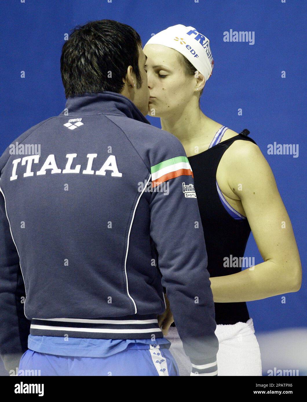 France's swimmer Laure Manaudou, right, kisses Italy's swimmer Luca ...