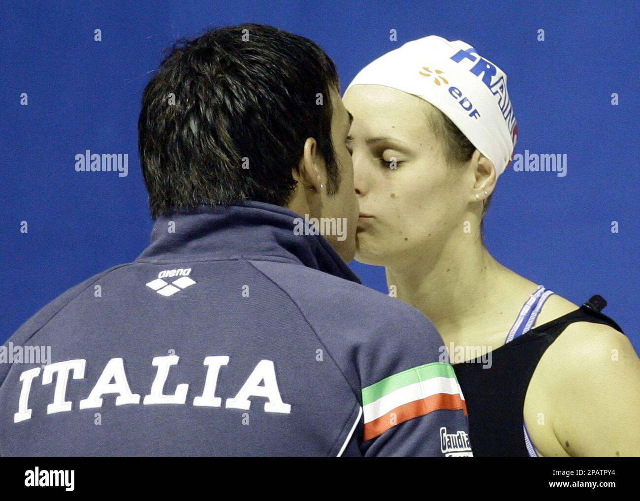 France's swimmer Laure Manaudou, right, kisses Italy's swimmer Luca ...