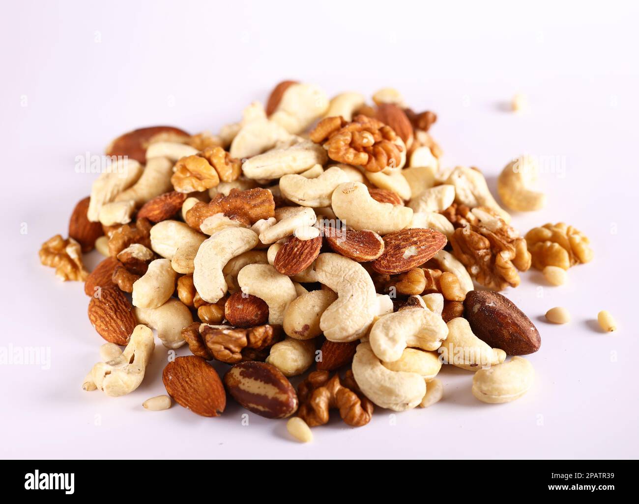 natural assorted nuts on white background Stock Photo - Alamy