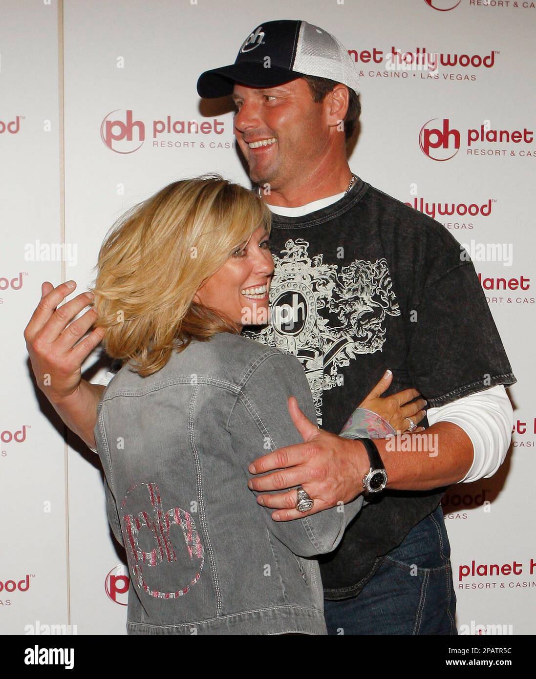 Roger Clemens and his wife Debbie arrive at the grand opening of the ...