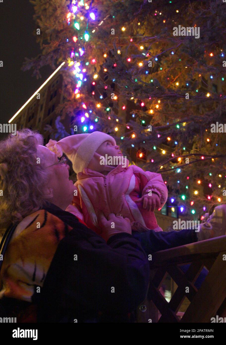 Barbara Trost helps her granddaughter, Nevaeh Davis, 2, get a closer ...