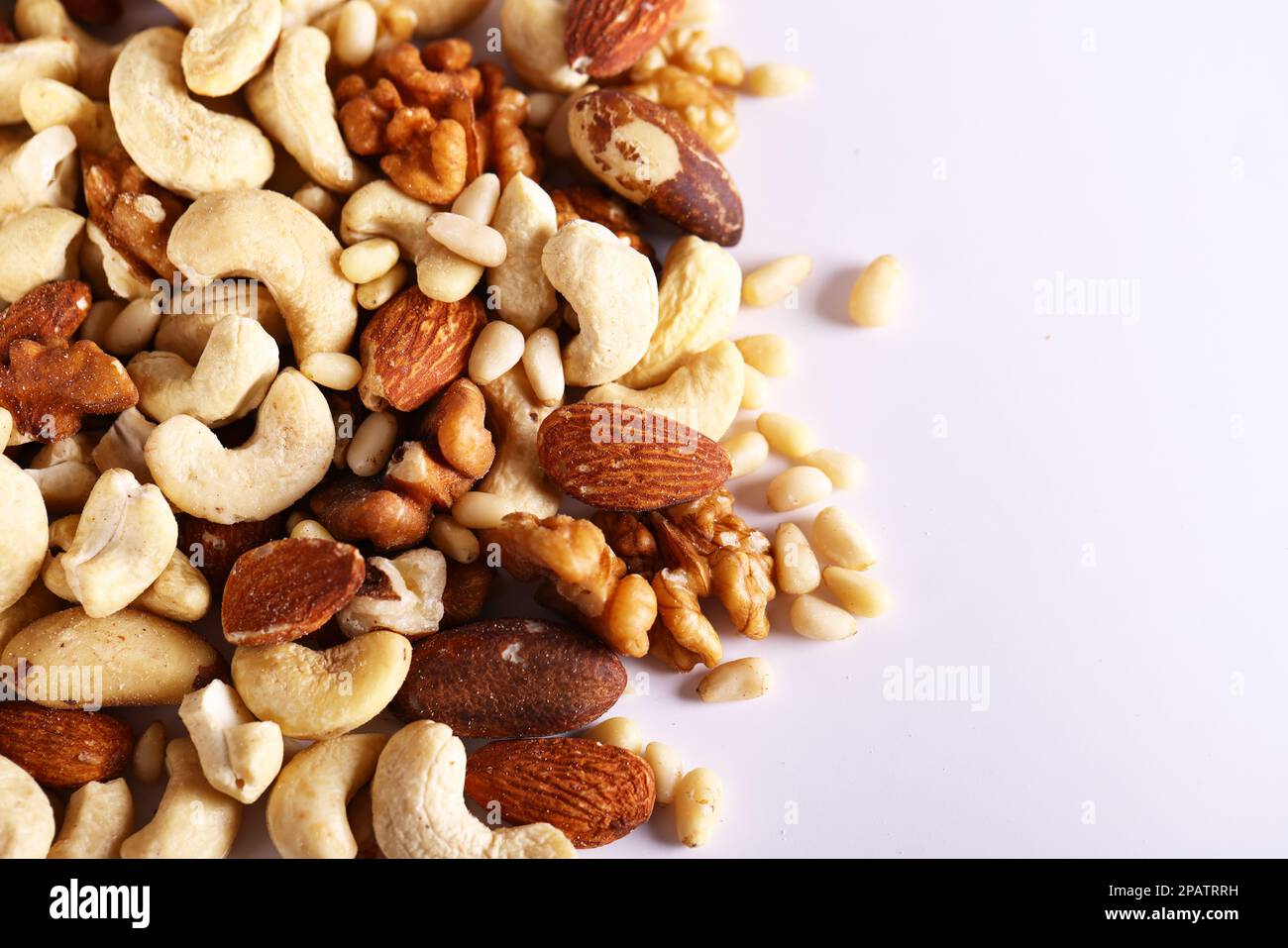 natural assorted nuts on white background Stock Photo - Alamy