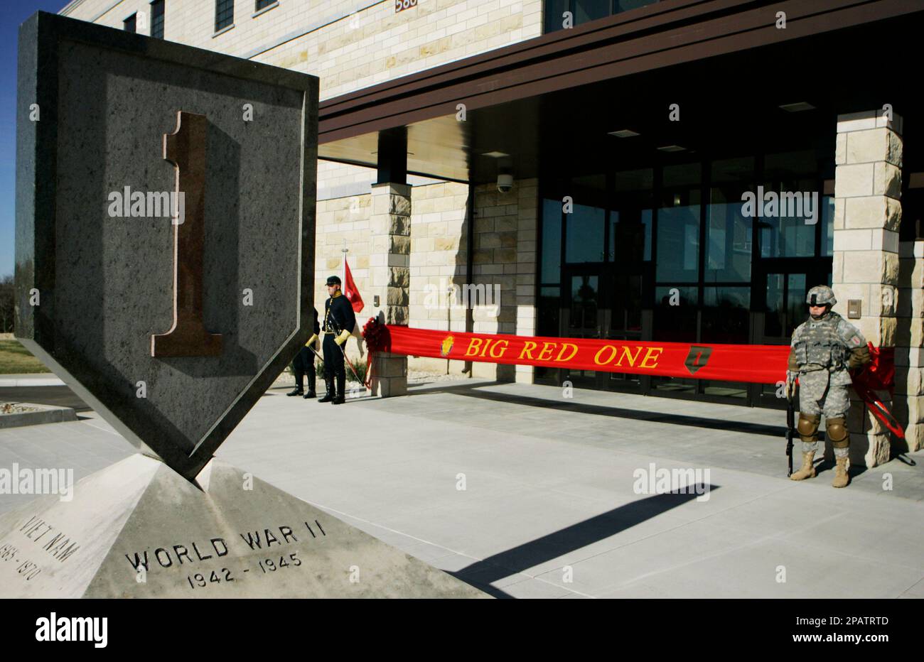 An honor guard stands at the entrance before ribbon cutting ceremonies ...
