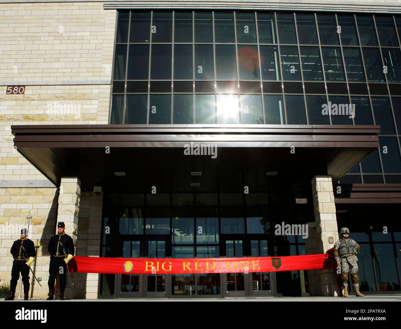 An honor guard stand at the entrance before ribbon cutting ceremonies ...