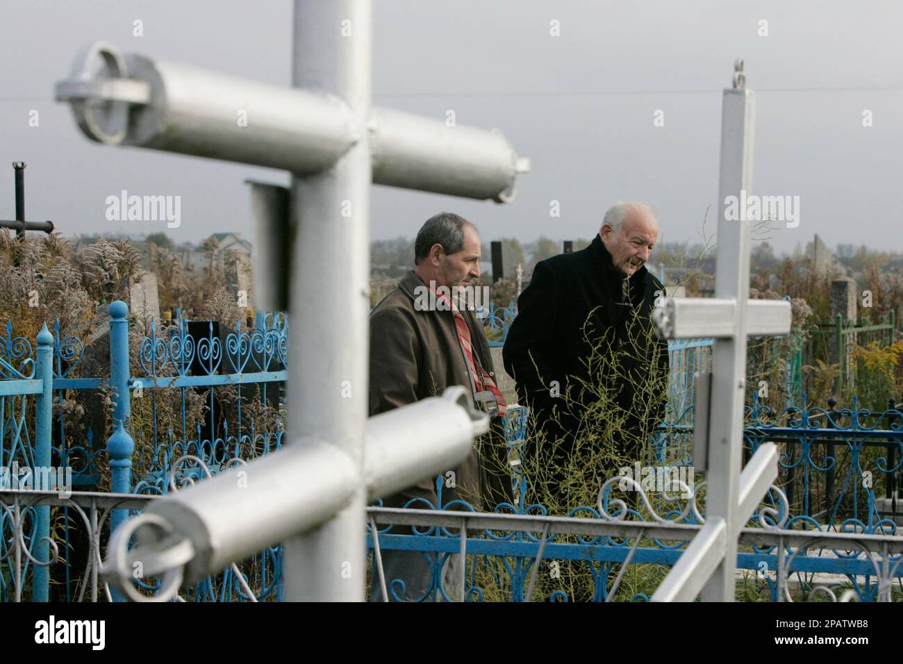 Erik Galperin, left, and Alex Kurzem visit the grave of Erik's father ...