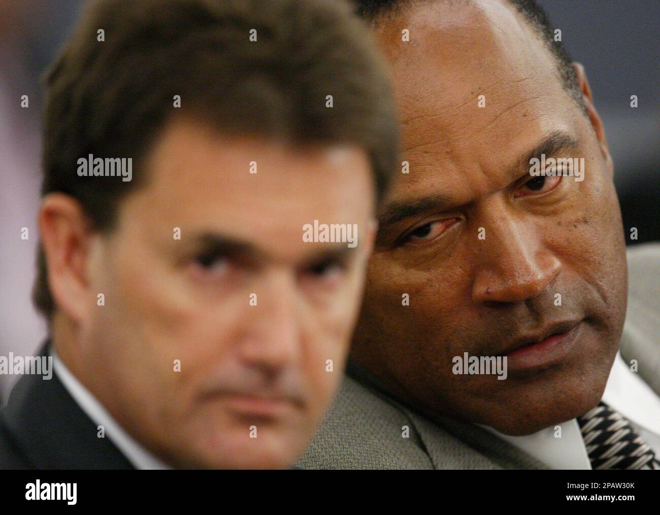 O.J. Simpson, right, and his lawyer Yale Galanter sit in a courtroom ...