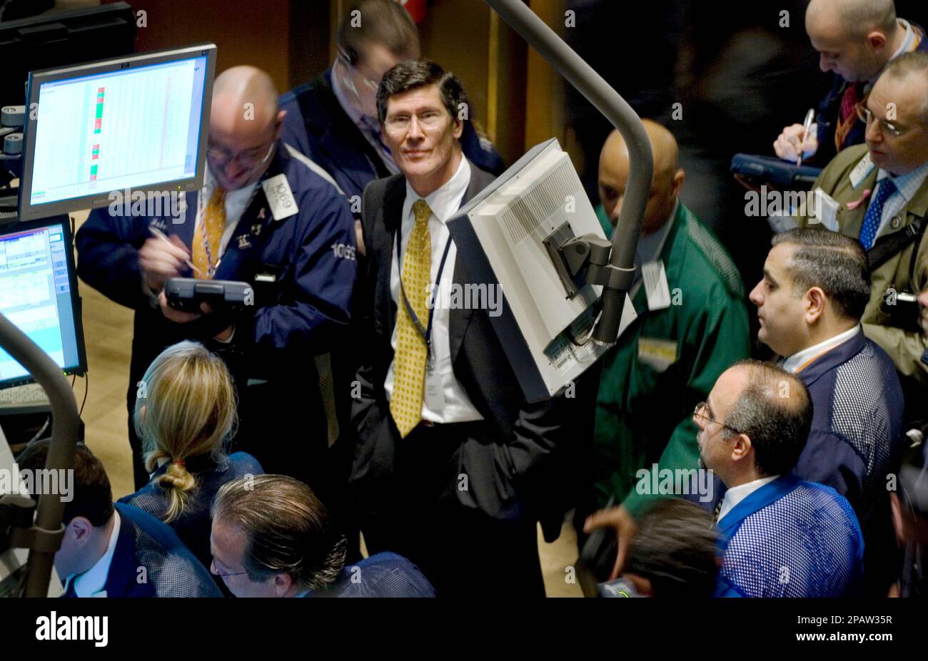** FILE ** John Thain, CEO of NYSE Euronext, looks up from the floor of ...