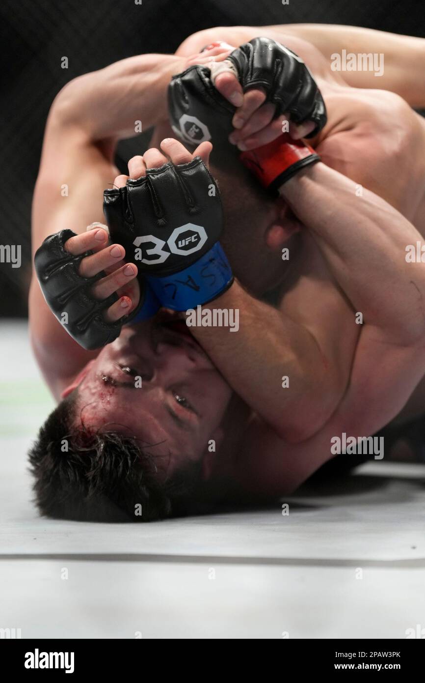 LAS VEGAS, NV - MARCH 4: Cameron Saaiman (top) controls the body of ...