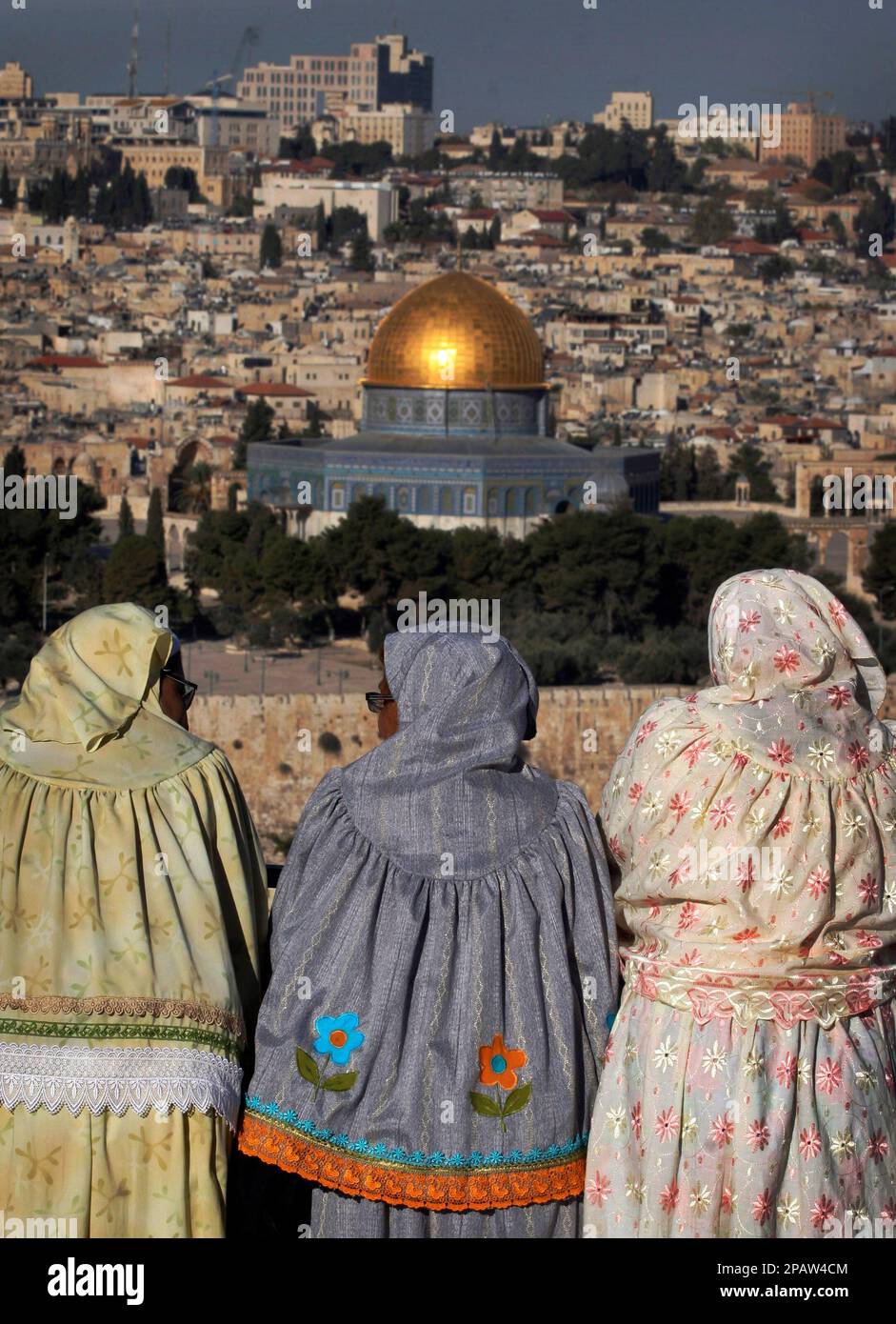 Muslim tourists from India look out towards the Dome of the Rock Mosque ...