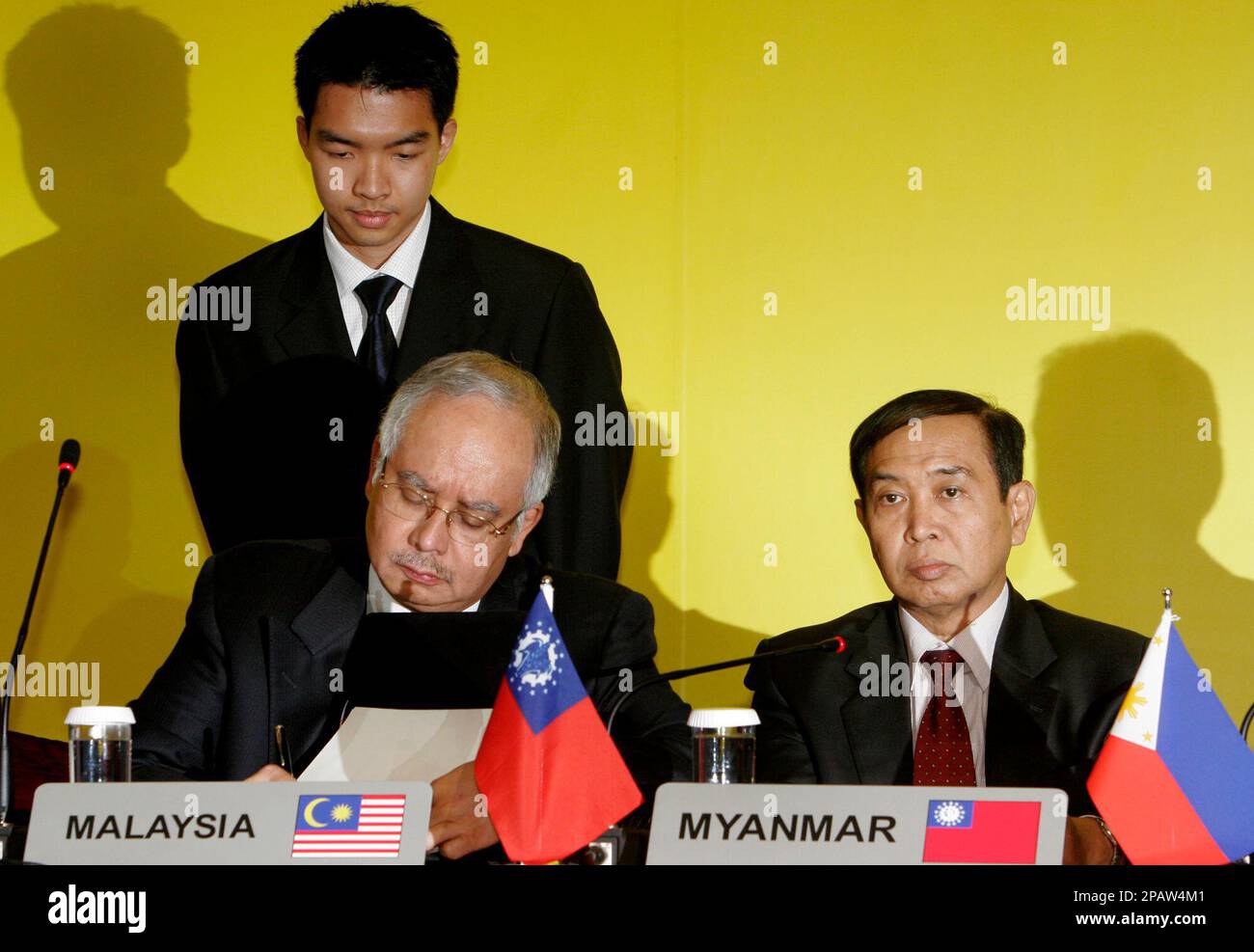 Myanmar's Defense Minister Major Gen. Aye Win, right, looks on as ...