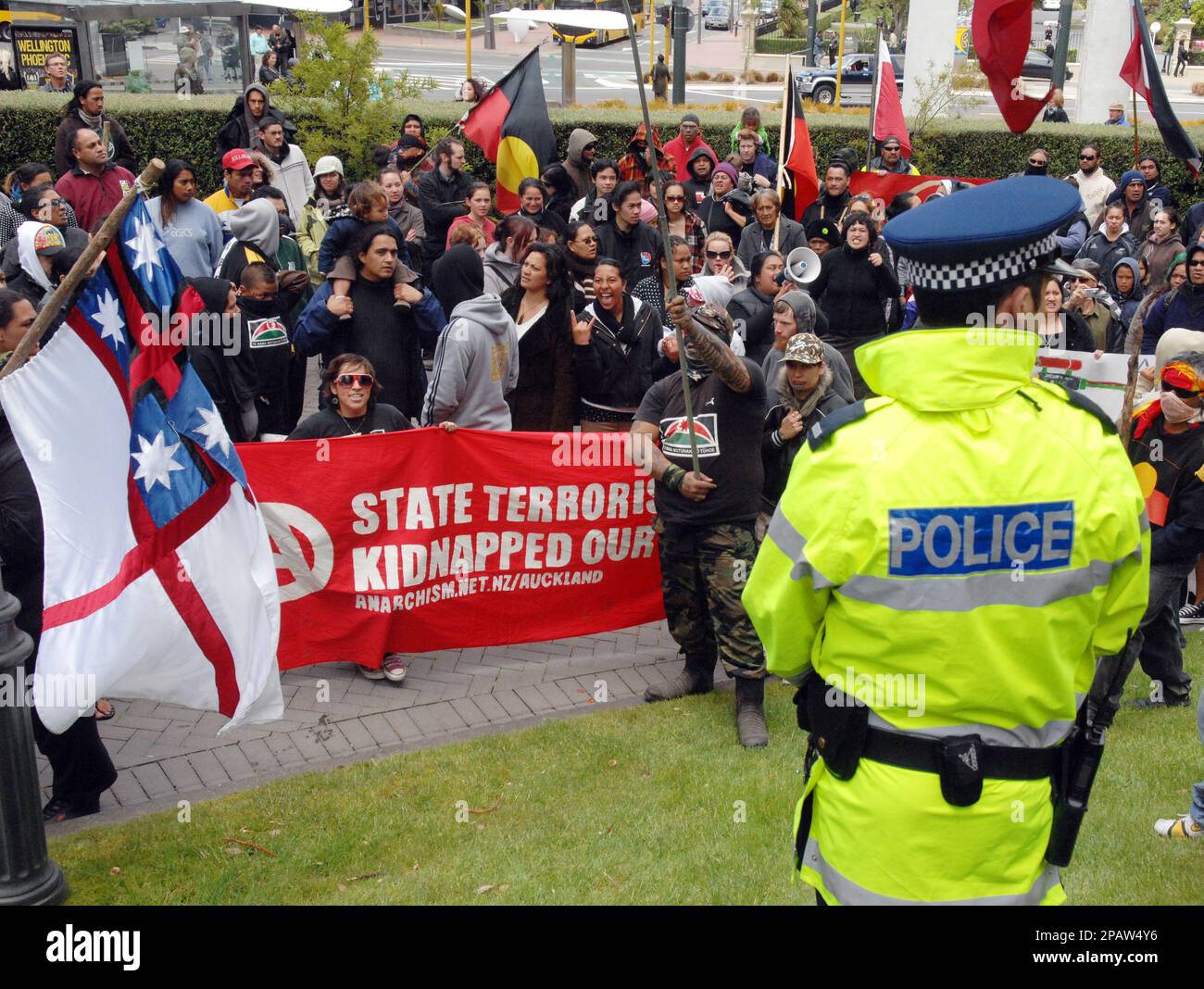 Police look on as Tuhoe Maori tribe members arrive at the grounds of ...