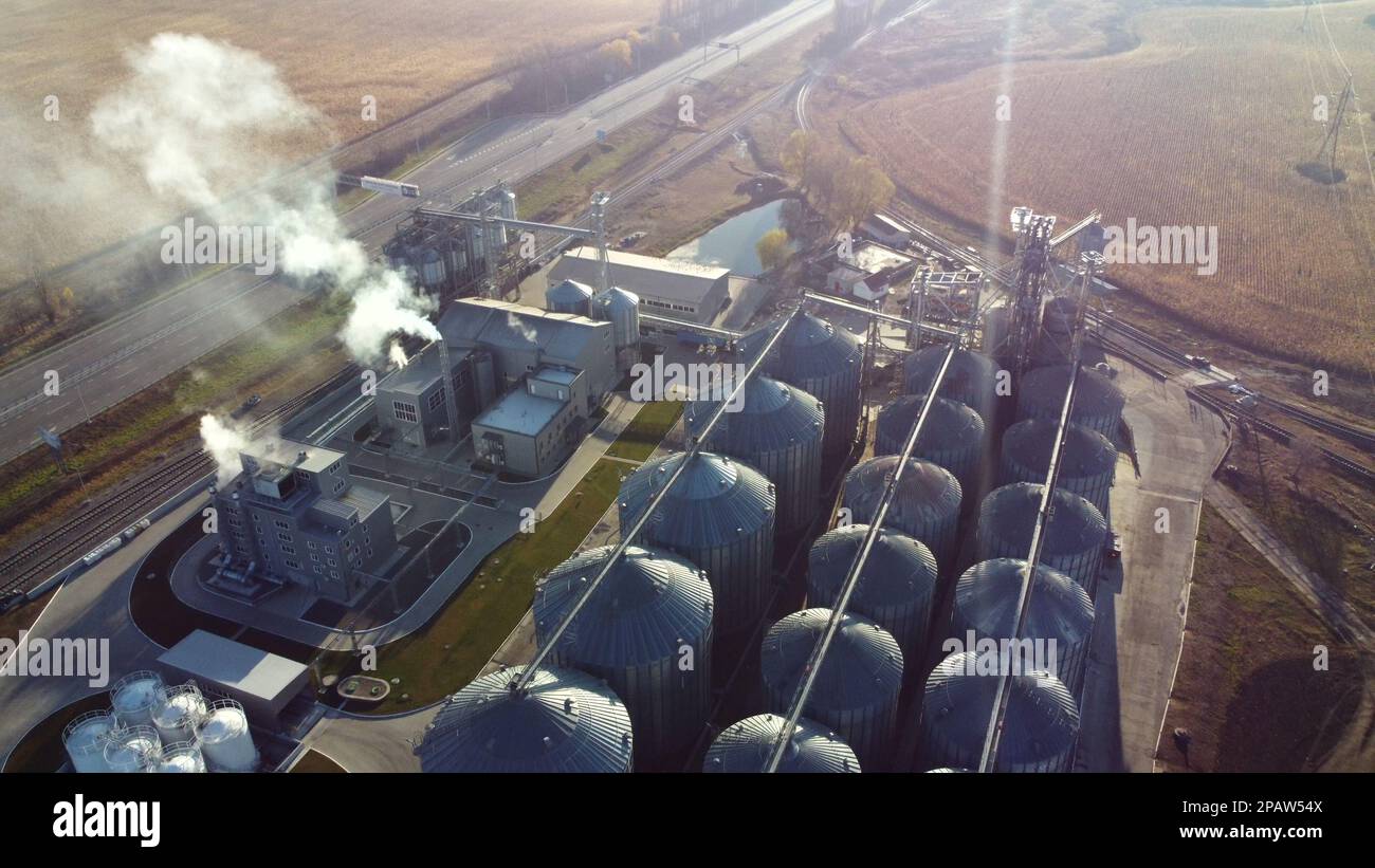 Aerial Drone View Flight Over complex of grain elevator buildings ...