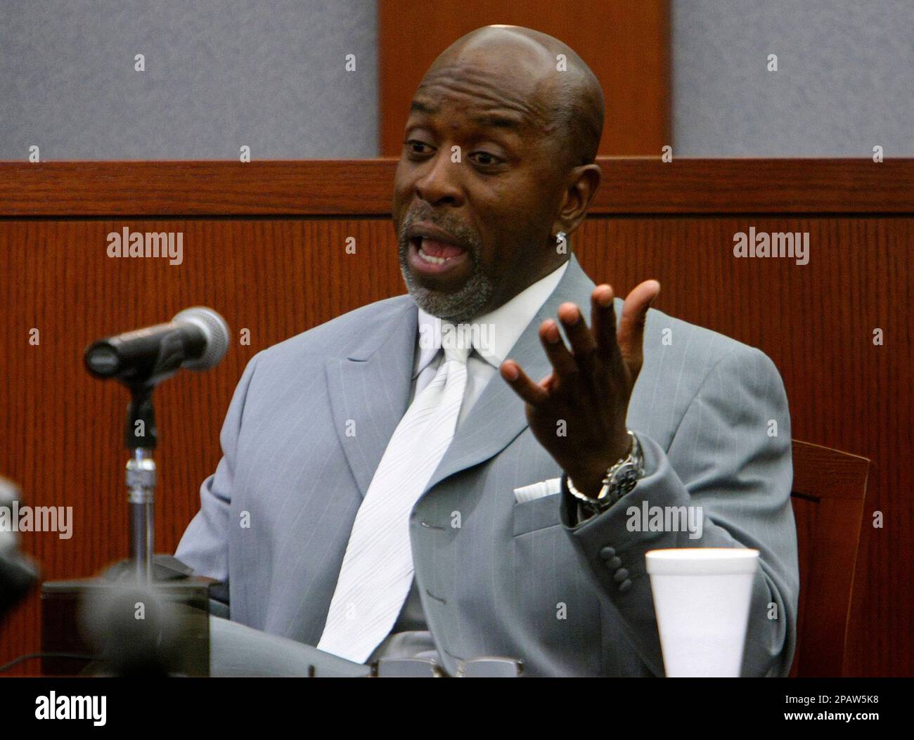 Michael McClinton testifies in a courtroom during O.J. Simpson's ...