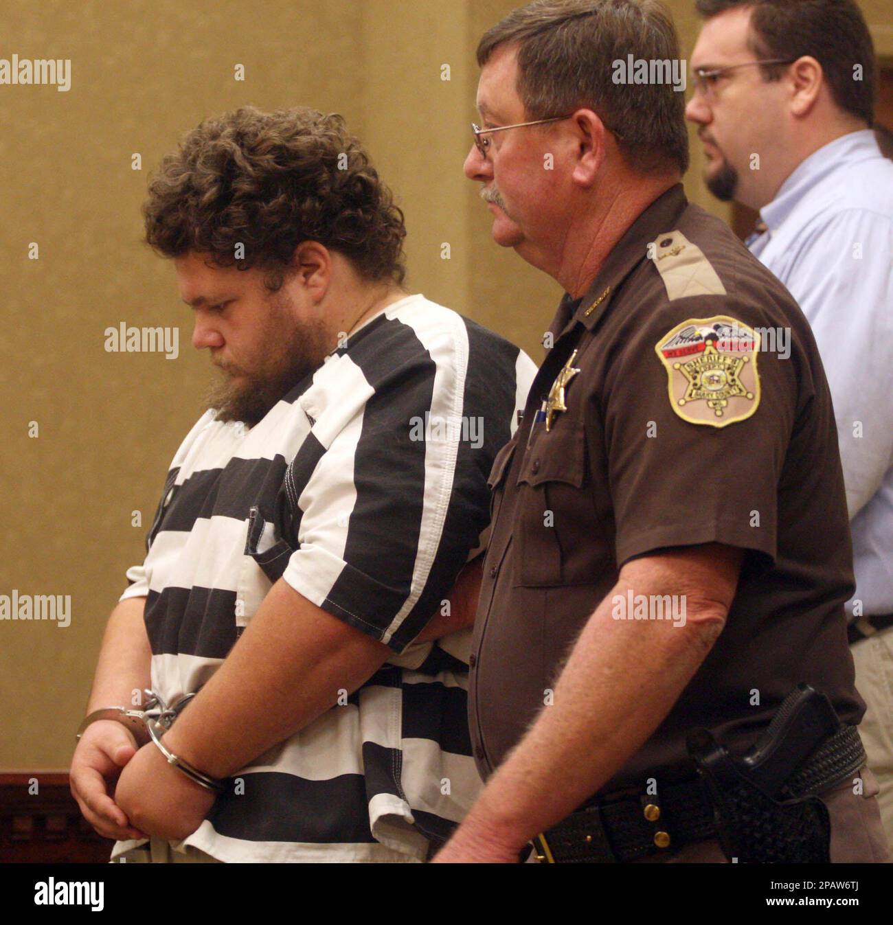 David Spears, left, is escorted by sheriff's deputies as he makes his ...