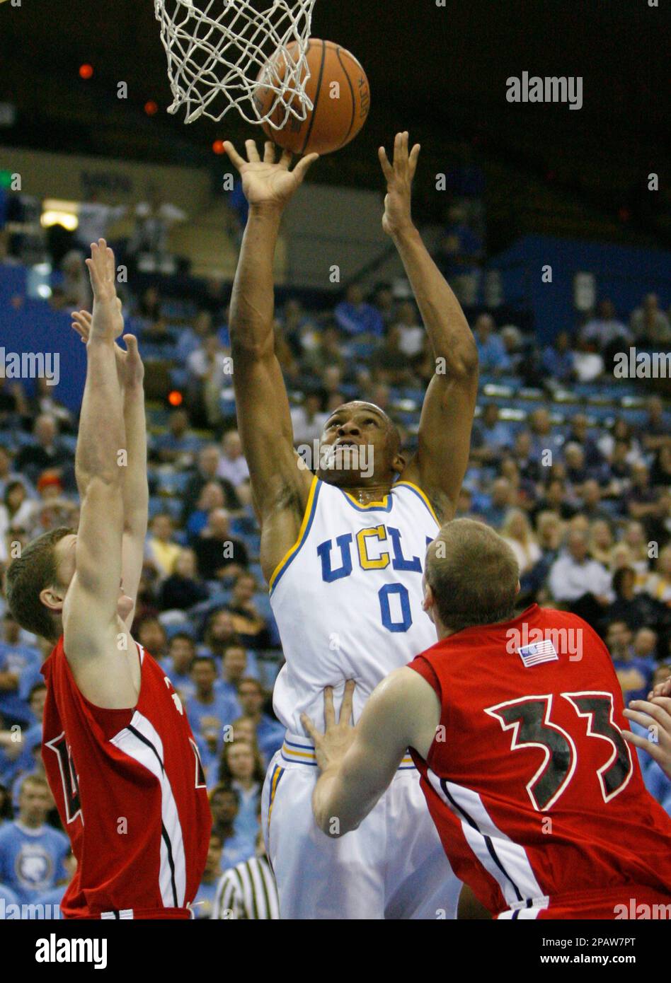 UCLA's Russell Westbrook (0) shoots over Youngstown State's Dan Boudler ...