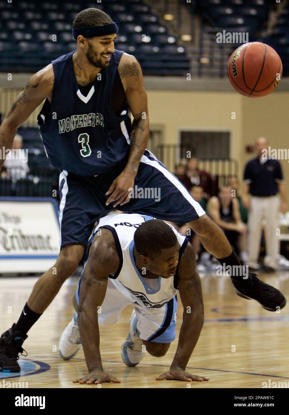 Cal State Monterey Bay's Ryan McBride, top, straddles San Diego's ...