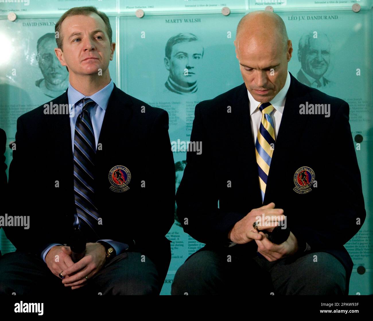 Hockey Hall of Fame inductee Mark Messier, right, inspects his ring as ...
