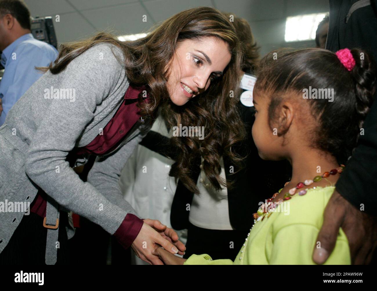 Queen Rania of Jordan, speaks with a child during her visit to the ...
