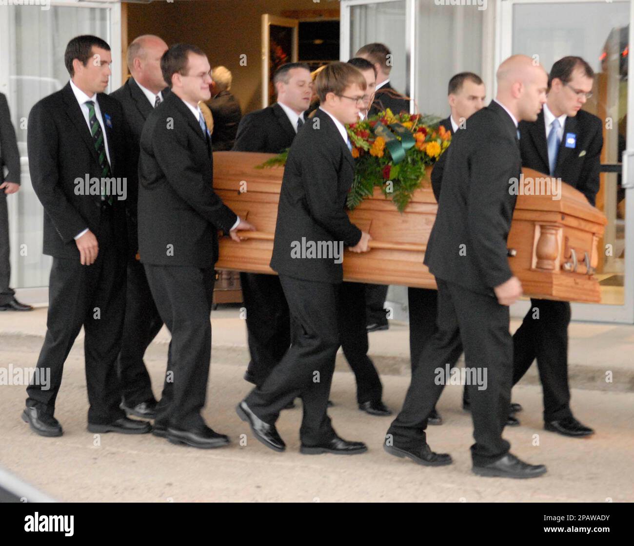 Pallbearers carry the coffin of Ryan Shay from his funeral at a chapel ...