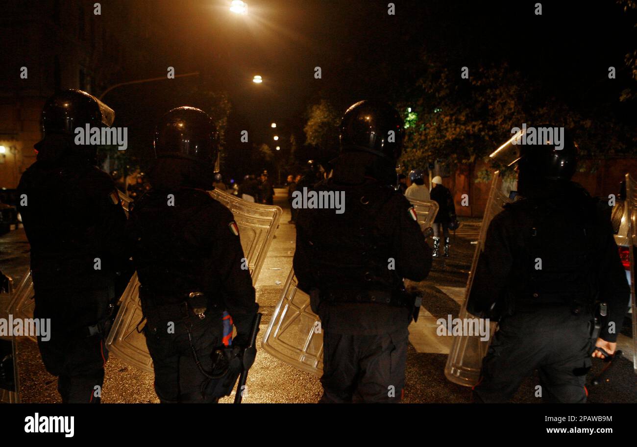 Anti-riot policemen stand in front of the entrance of a Police barracks ...