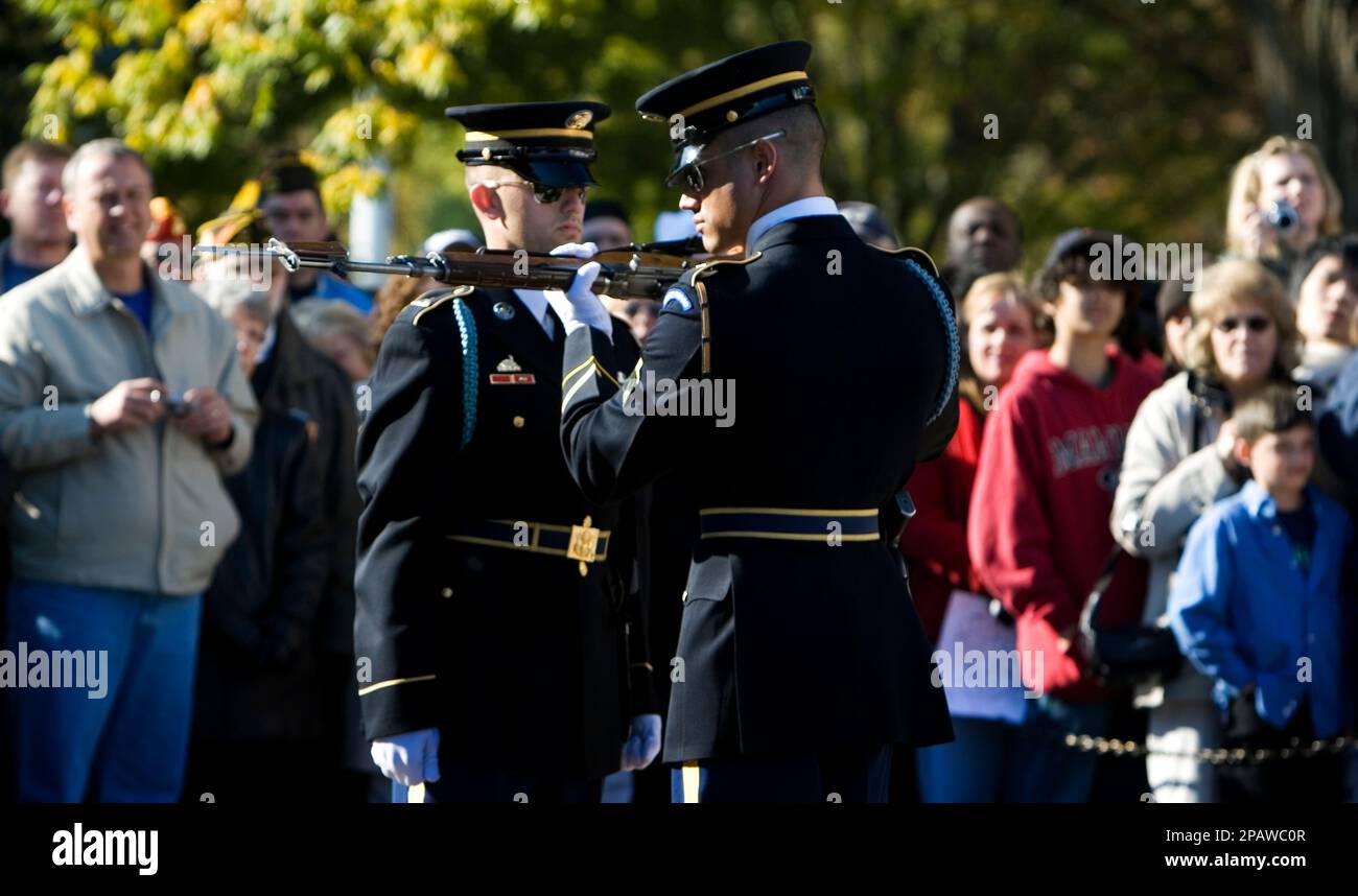 An honor guard's rifle is inspected, during the ceremonial changing of ...