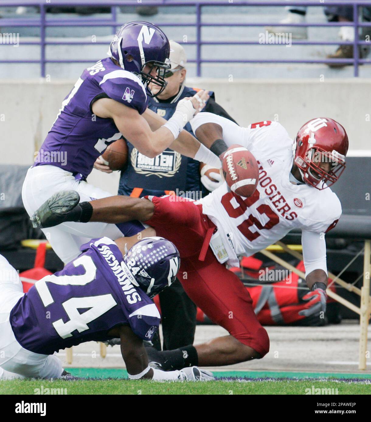 Indiana wide receiver James Hardy, right, is forced out of bounds by ...
